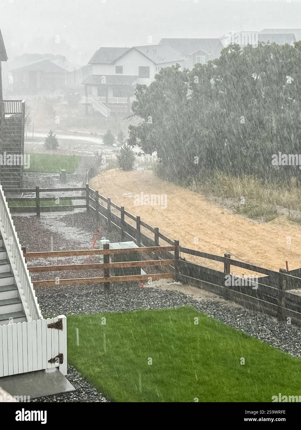 Heavy rainfall in residential neighborhood backyard Stock Photo - Alamy