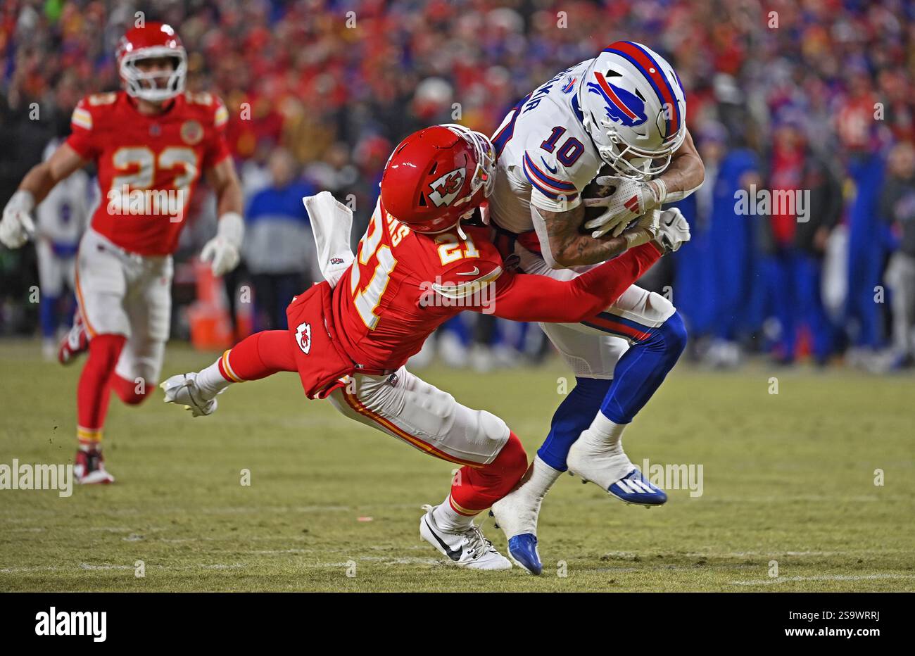 Kansas City Chiefs safety Jaden Hicks (21) tackles Buffalo Bills wide ...