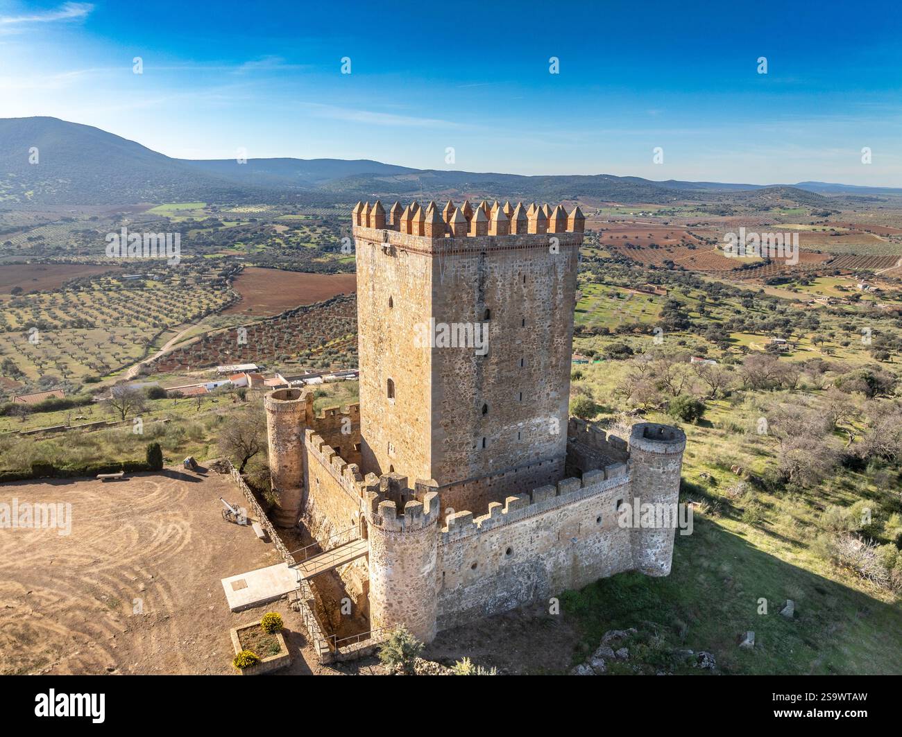 Aerial view of Nogales castle in Spain with homage tower, battlements ...