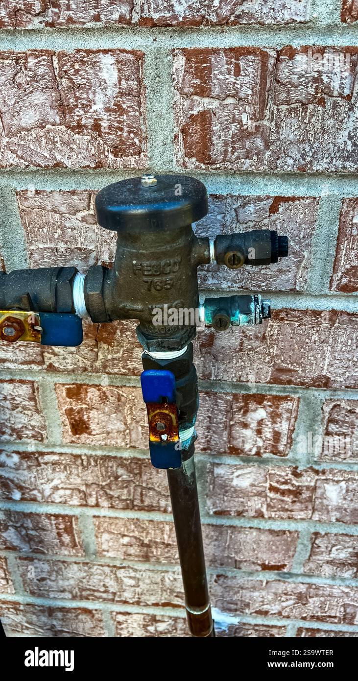 Residential irrigation system backflow preventer outdoors Stock Photo ...