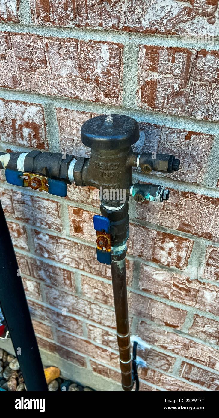 Residential irrigation system backflow preventer outdoors Stock Photo ...