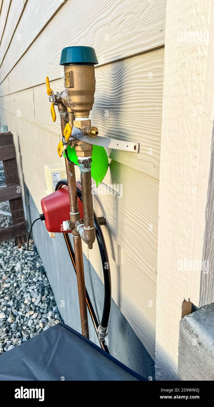 Residential irrigation system backflow preventer outdoors Stock Photo ...