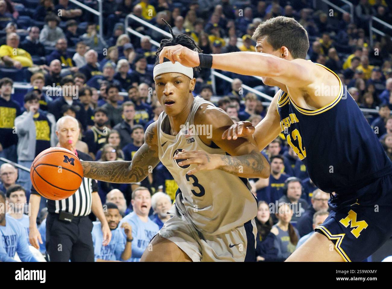 Penn State guard Nick Kern Jr. (3) drives against Michigan forward Will ...