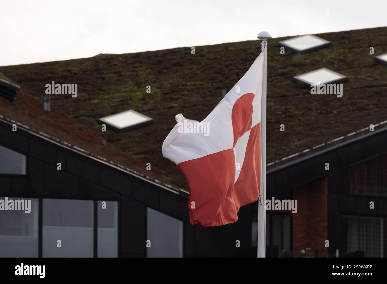 The flag of Greenland flutters at Strandgade, Copenhagen, Denmark ...
