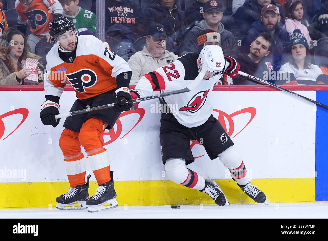 New Jersey Devils' Brett Pesce, right, collides with Philadelphia ...