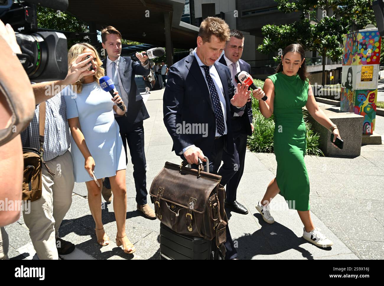Brisbane, Australia. 28th Jan, 2025. Lawyer, Mathew Cuskelly (centre ...