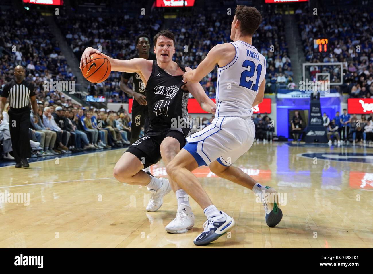 PROVO, UT - JANUARY 25: BYU Cougars guard Trevin Knell (21) defends ...