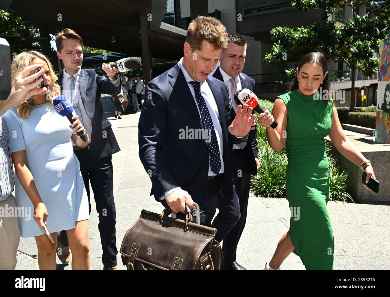 Brisbane, Australia. 28th Jan, 2025. Lawyer, Mathew Cuskelly (centre ...