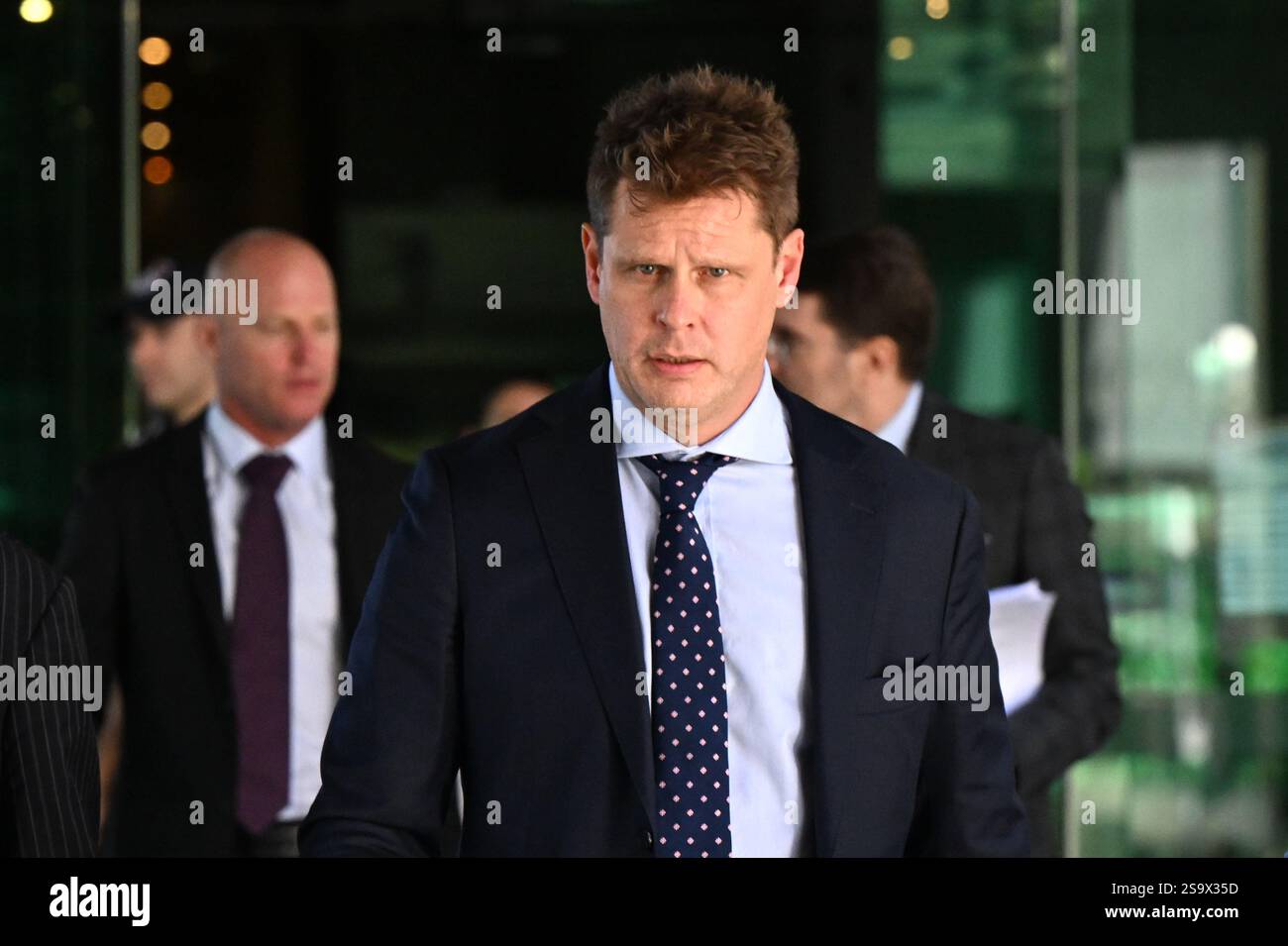 Brisbane, Australia. 28th Jan, 2025. Lawyer, Mathew Cuskelly (centre ...