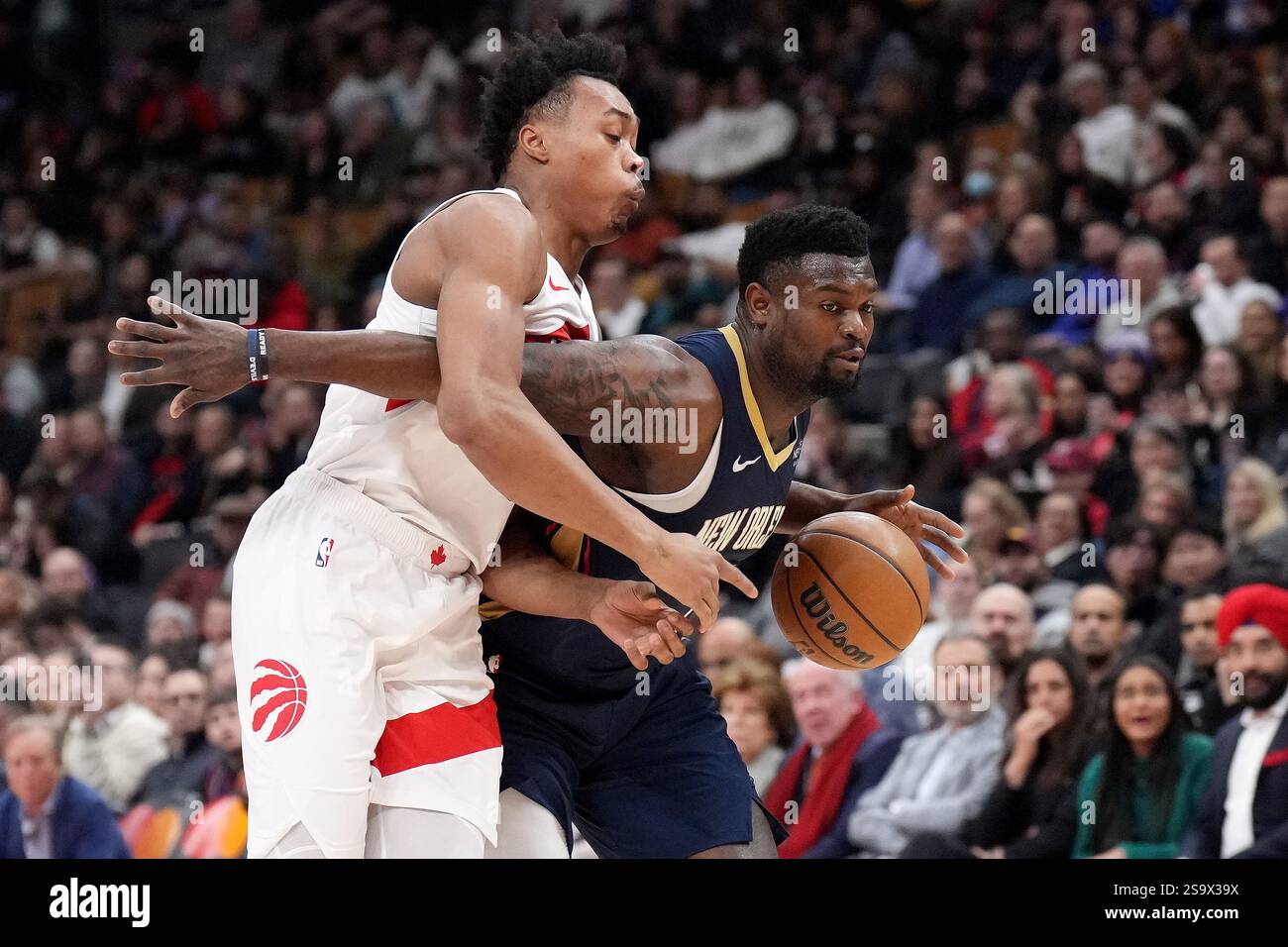 Toronto, Canada. 27th Jan, 2025. Toronto Raptors forward Scottie Barnes (4) and New Orleans ...