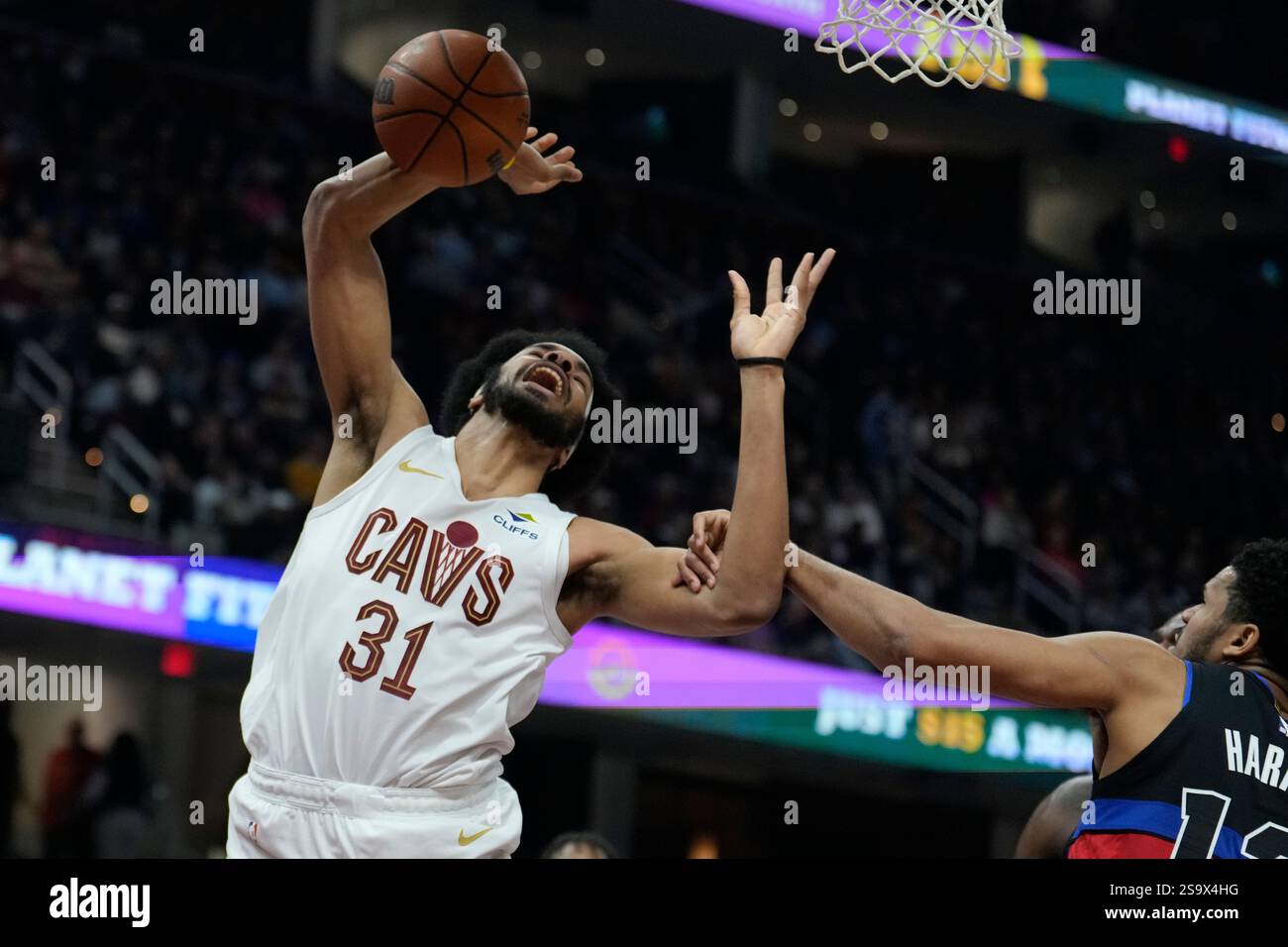 Cleveland Cavaliers center Jarrett Allen (31) is fouled by Detroit Pistons guard Ron Harper Jr ...