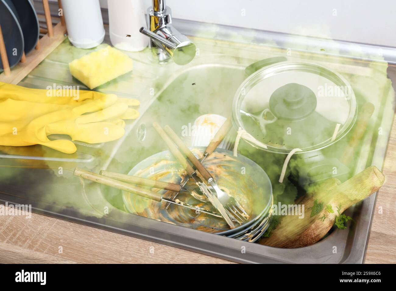 Smelly dirty dishes in sink Stock Photo - Alamy