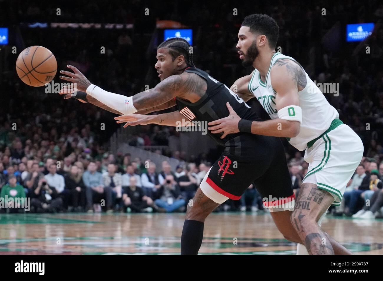 Houston Rockets guard Jalen Green, left, passes the ball while ...