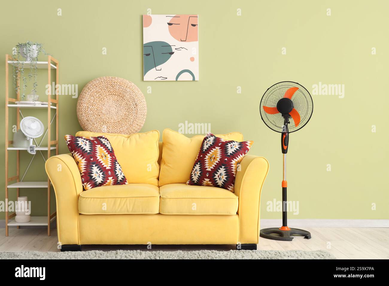 Interior of stylish living room with modern electric fan and yellow ...