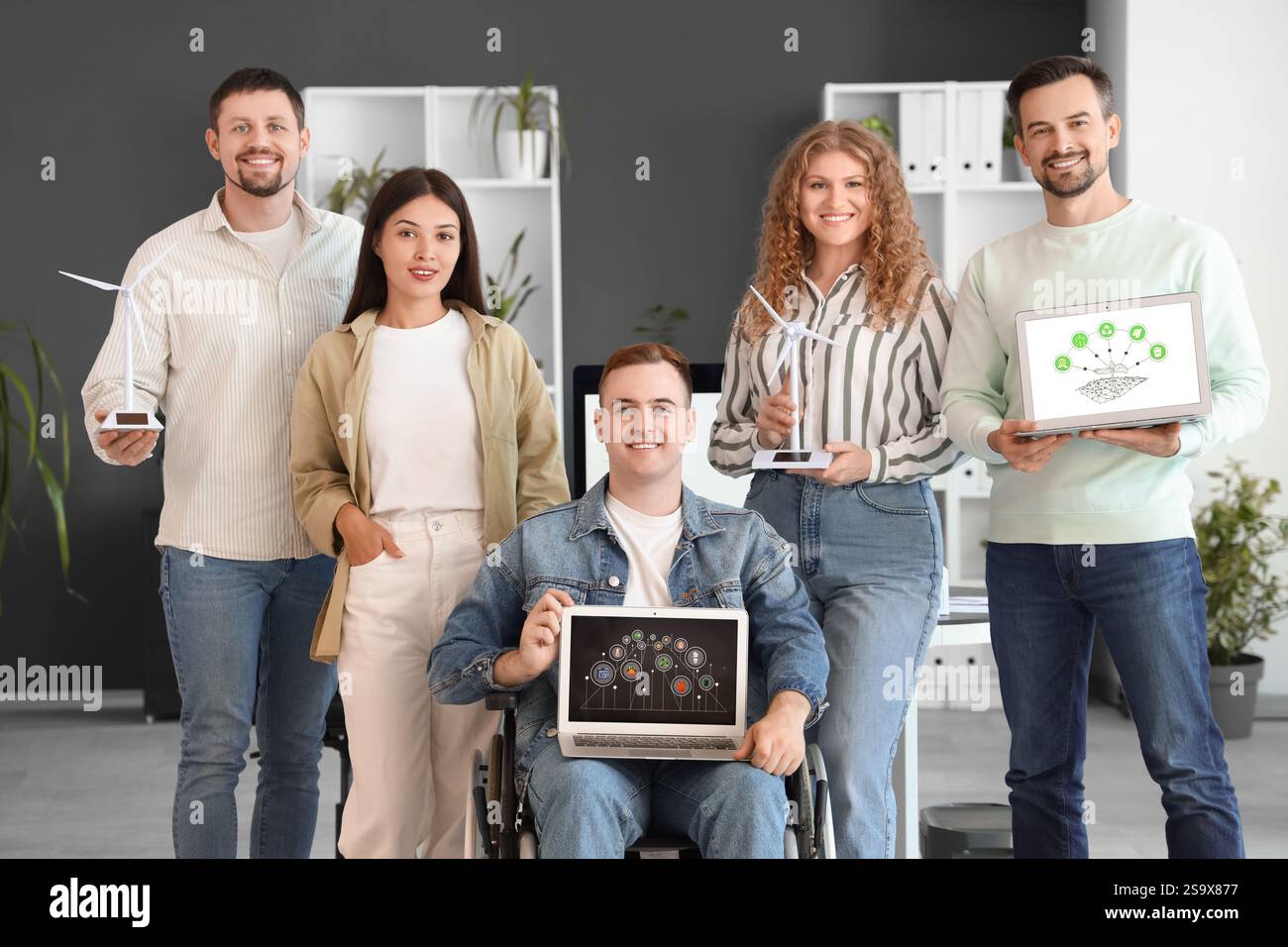 Colleagues laptops wind turbine hi-res stock photography and images - Alamy