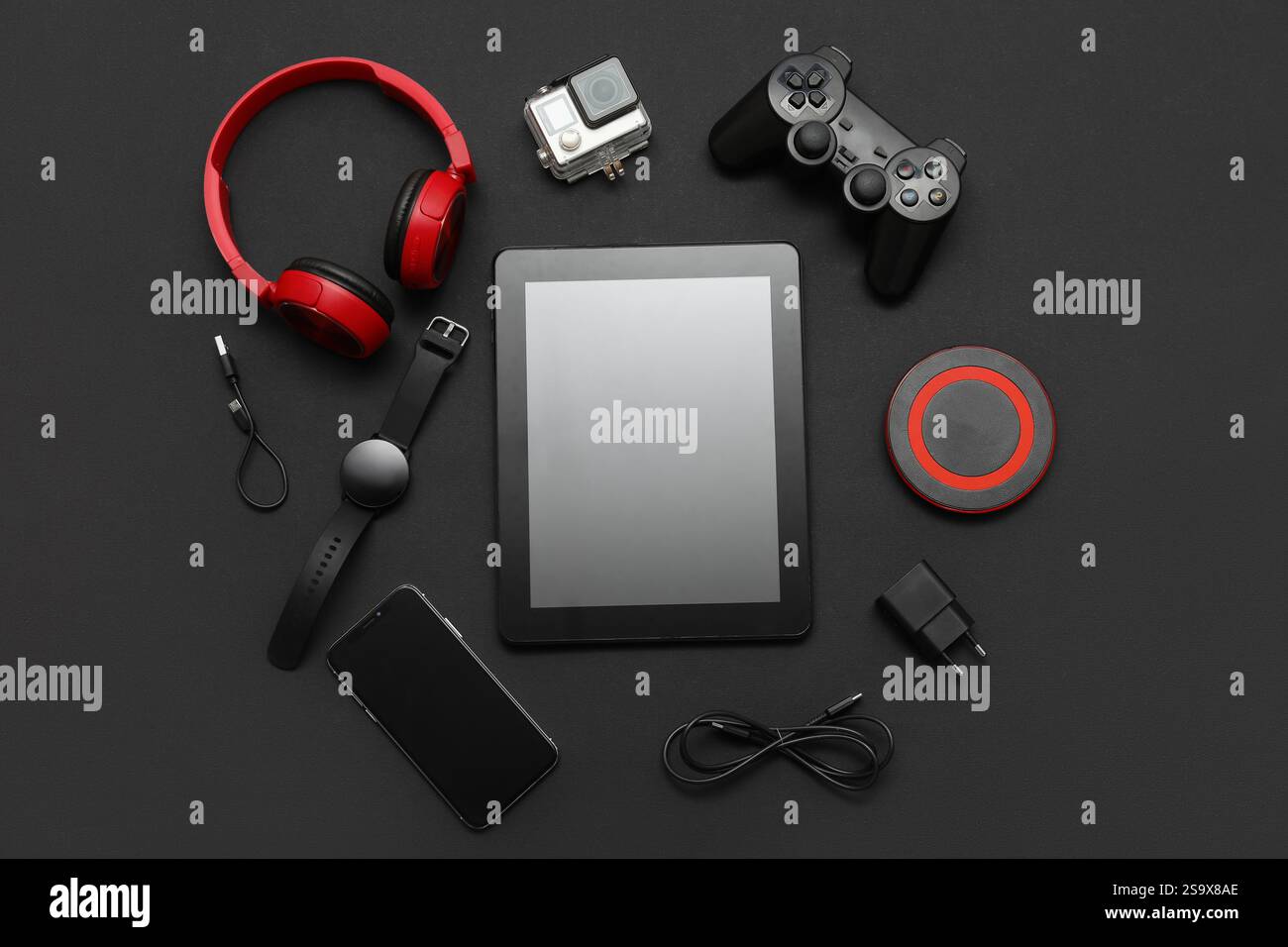 Set of modern devices on black background, top view Stock Photo - Alamy