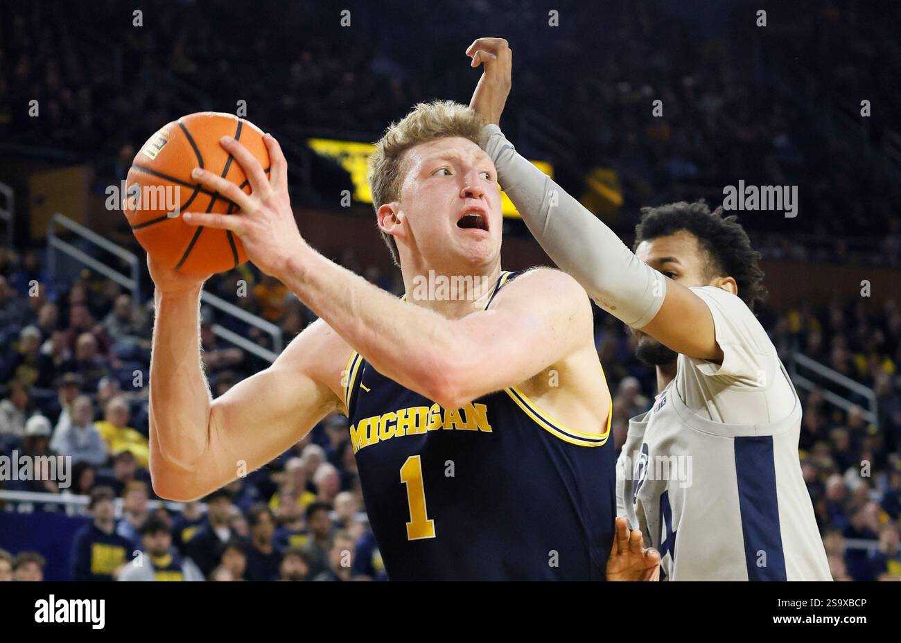 Michigan center Danny Wolf (1) goes to the basket against Penn State ...