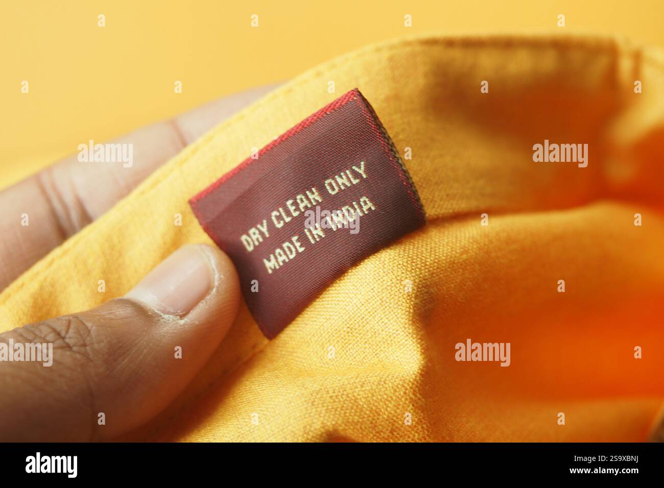 Clothing label showing care instructions and origin details Stock Photo ...