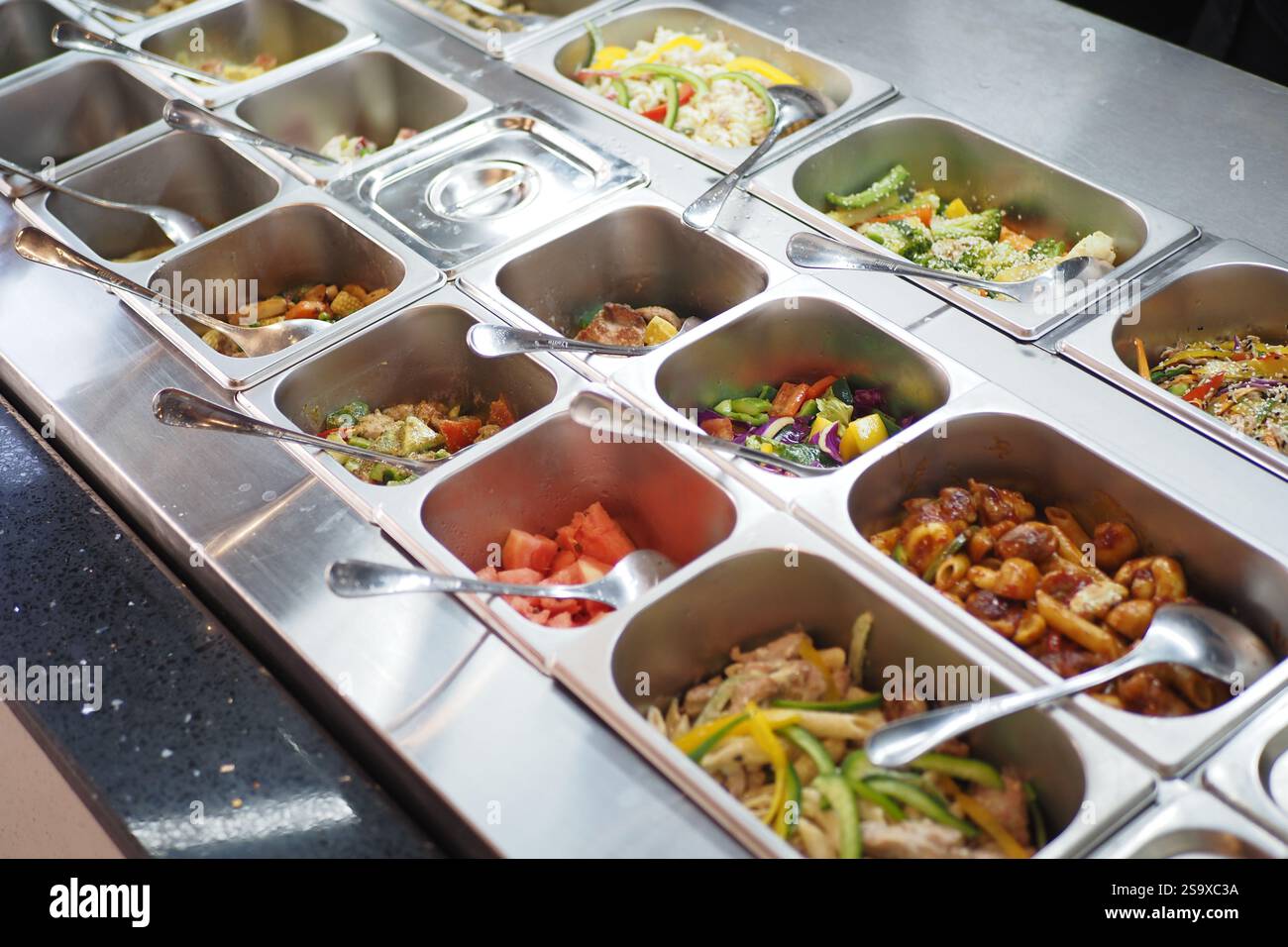 Buffet with variety of dishes in a dining area Stock Photo - Alamy