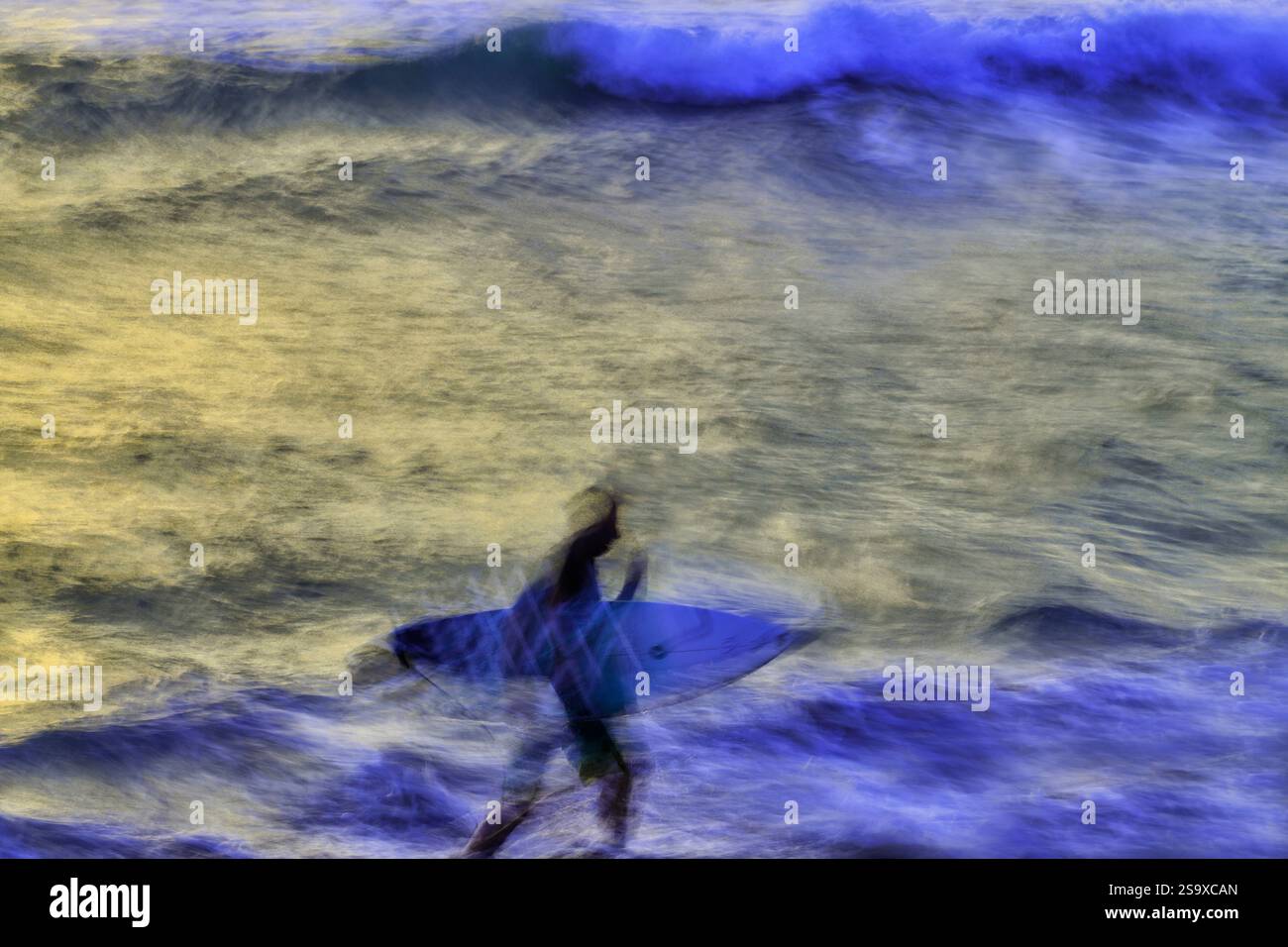 Surfing Bali waves along the south coast Indonesia Stock Photo - Alamy