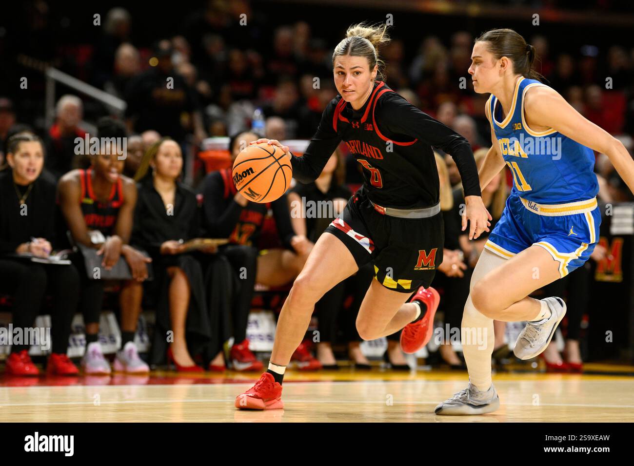 Maryland guard Saylor Poffenbarger (6) dribbles the ball against UCLA ...