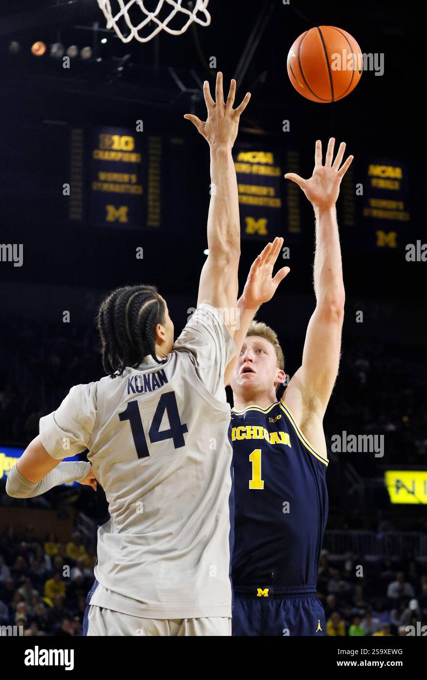 Michigan center Danny Wolf (1) takes a shot against Penn State forward ...