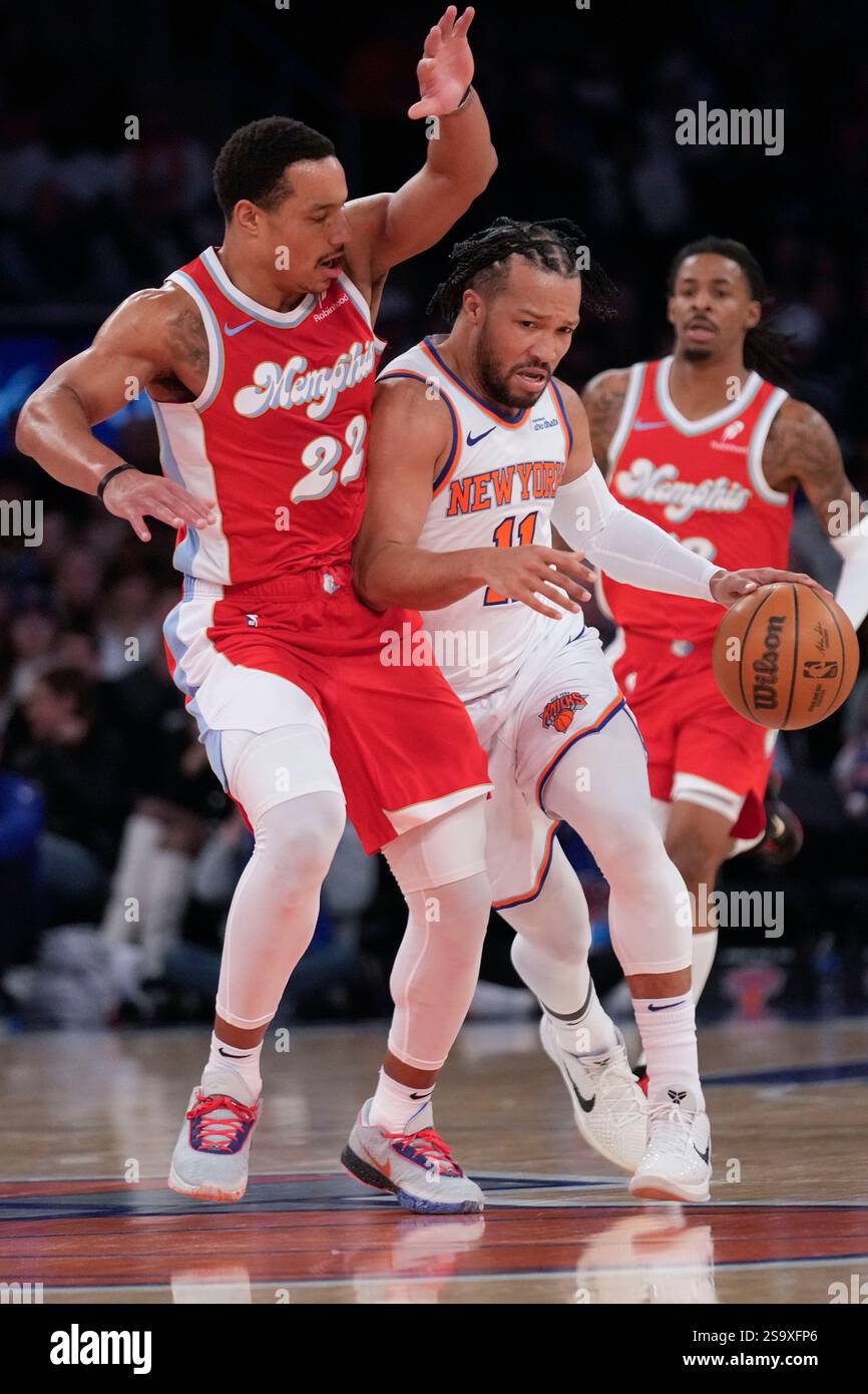 New York Knicks' Jalen Brunson, center, brings the ball up the court ...