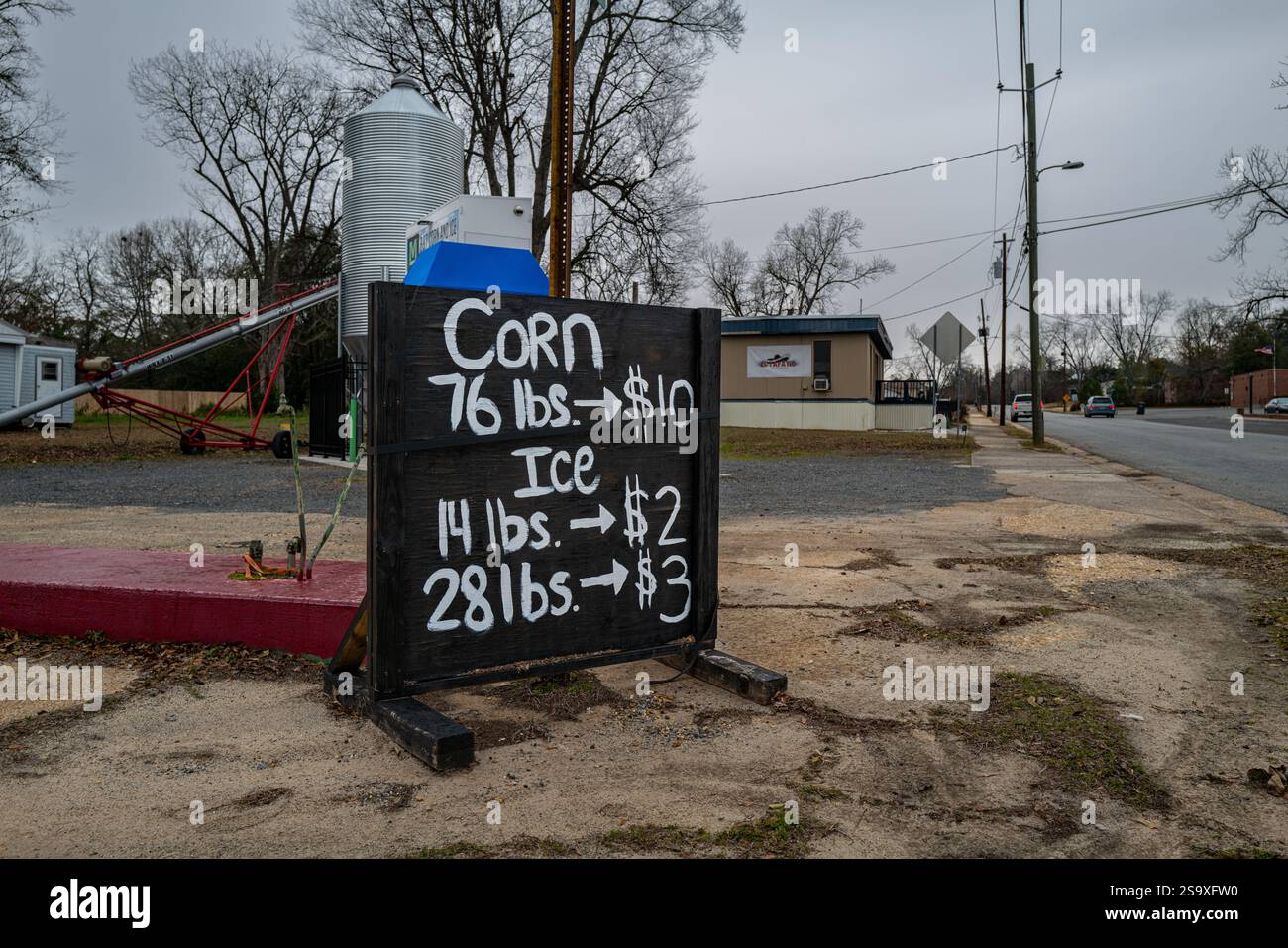 A sign advertises corn for sale. Corn farmers are a low-income cycle ...