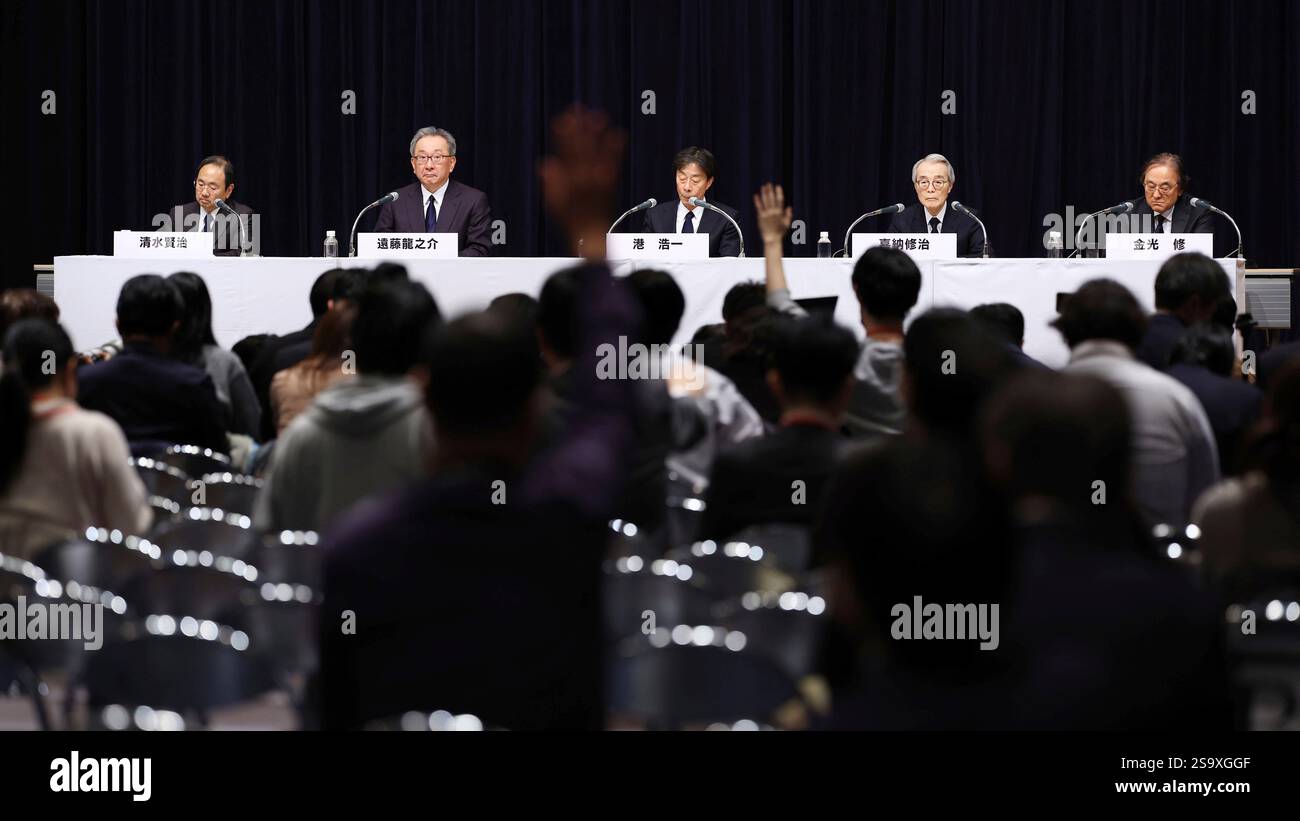 Fuji Television President Koichi Minato (C) and Chairman Shuji Kano ...