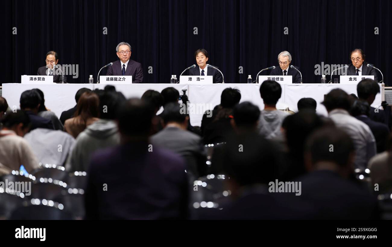Fuji Television President Koichi Minato (C) and Chairman Shuji Kano ...
