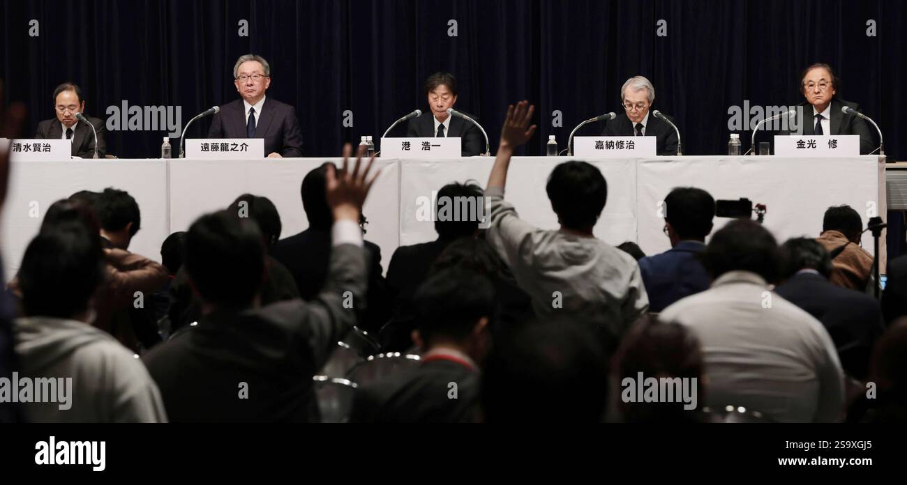 Fuji Television President Koichi Minato (C) and Chairman Shuji Kano ...