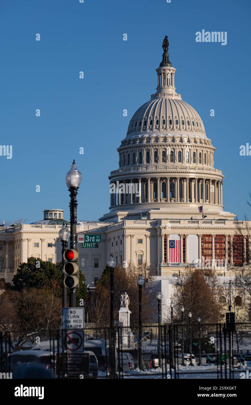 Vertical view of the Capitol building with American flag, rotunda dome ...
