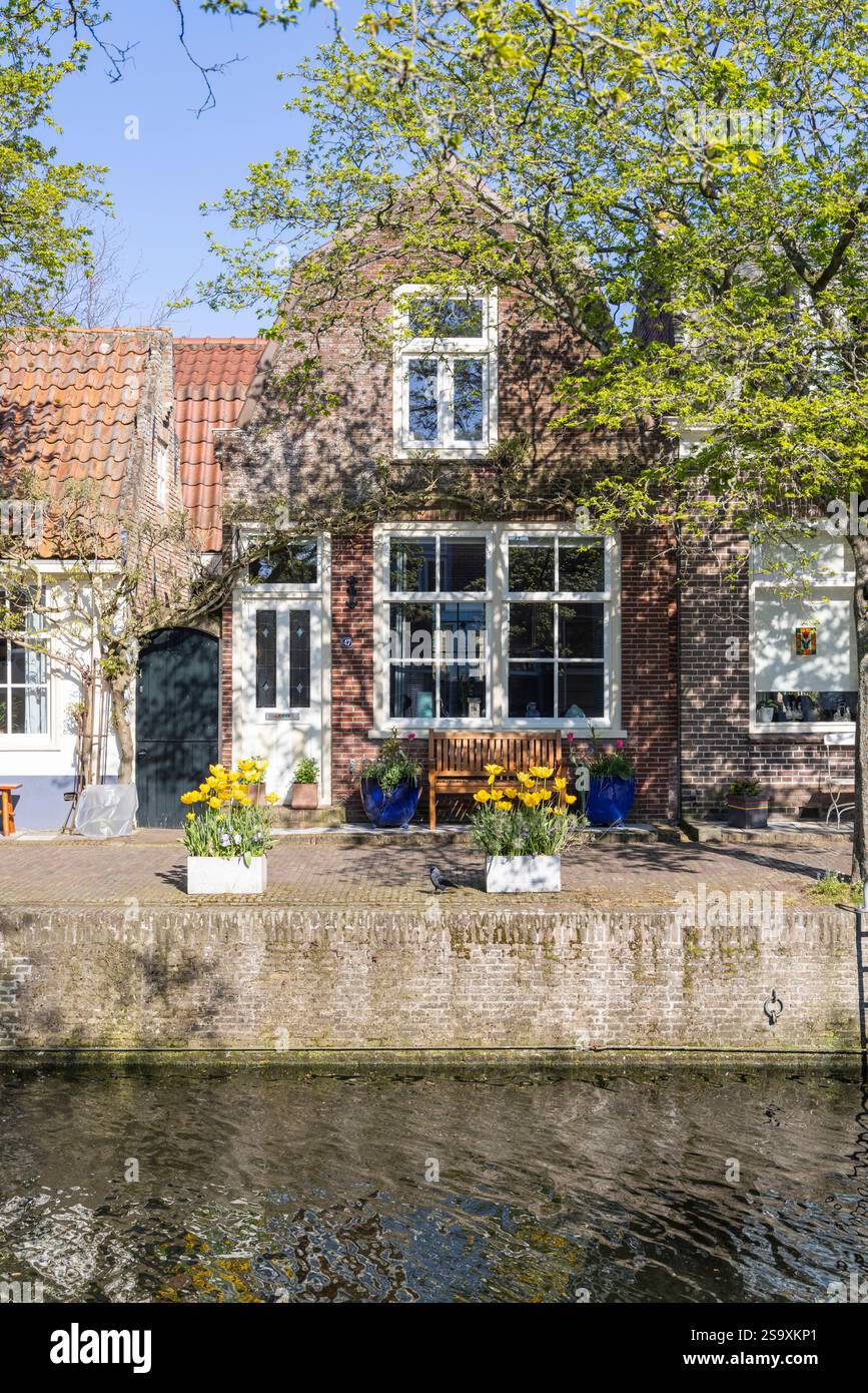 Netherlands, North Holland, Enkhuizen. Small brick buildings along a ...