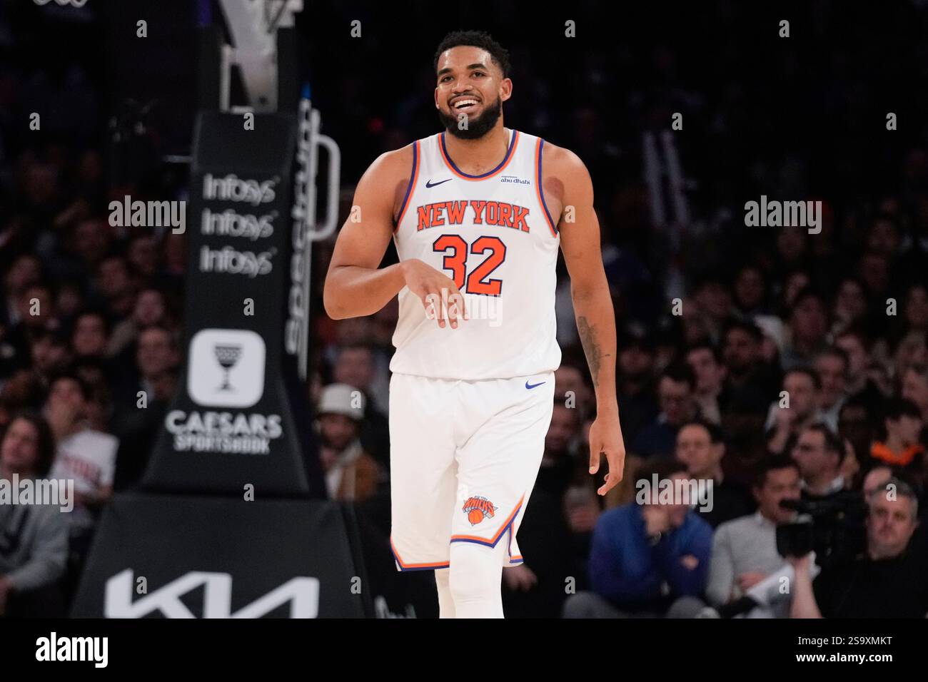 New York Knicks' Karl-Anthony Towns smiles during the second half of an ...