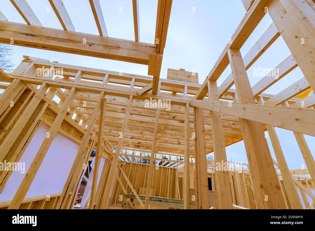 Constructing wooden beams framework for building as they prepare for ...