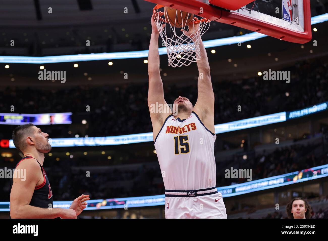 Denver Nuggets center Nikola Jokic (15) slam-dunks during the second ...