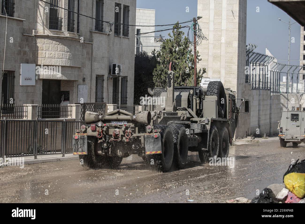 Jenin, Palestine. 27th Jan, 2025. Israeli military vehicles patrol the ...