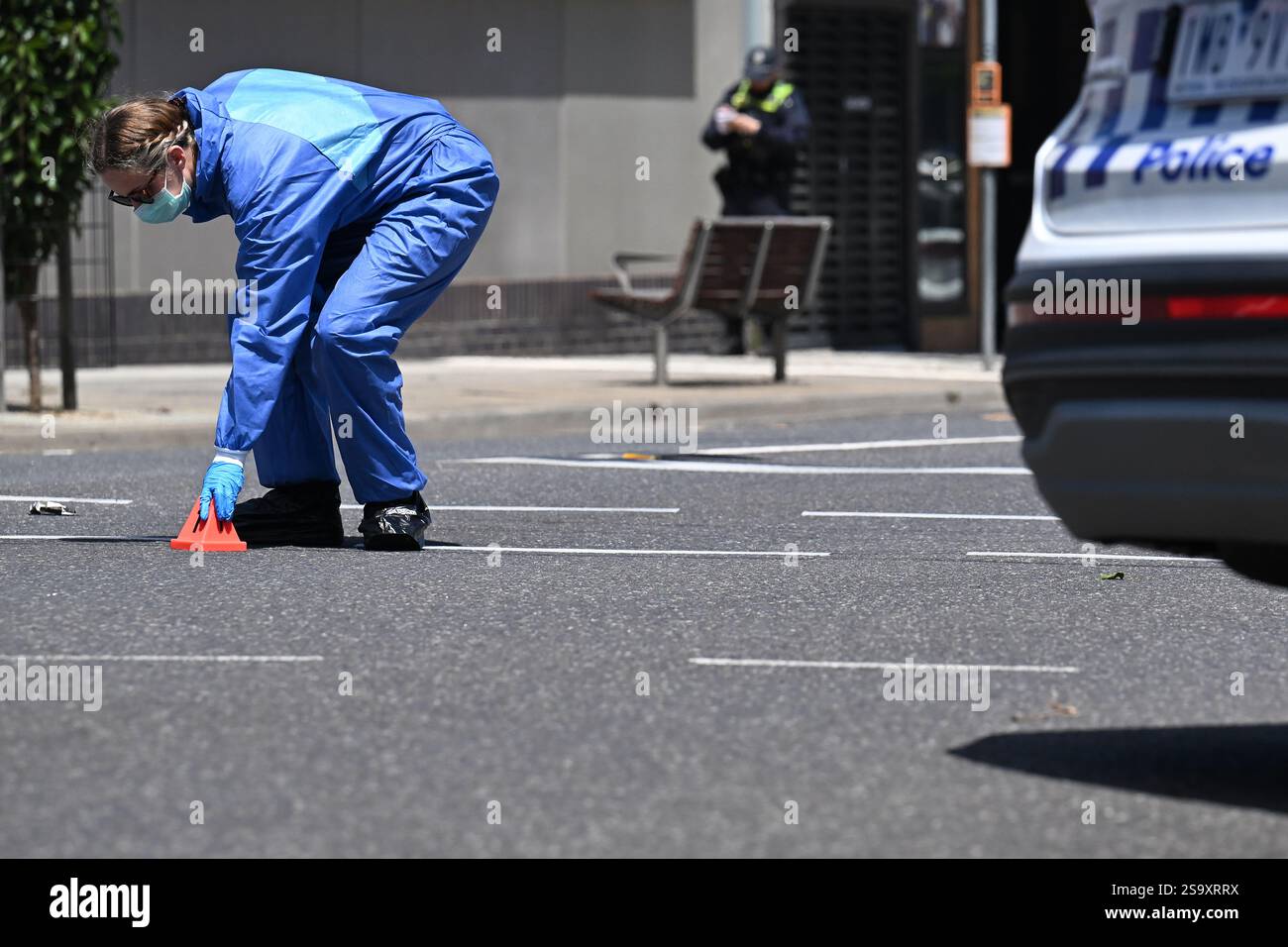 Melbourne, Australia. 28th Jan, 2025. A forensic detective places an ...