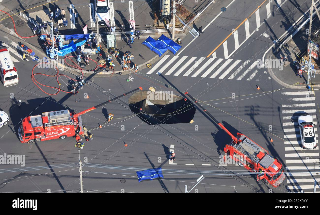 An aerial photo shows a road collapsed site and trapping a track driver ...