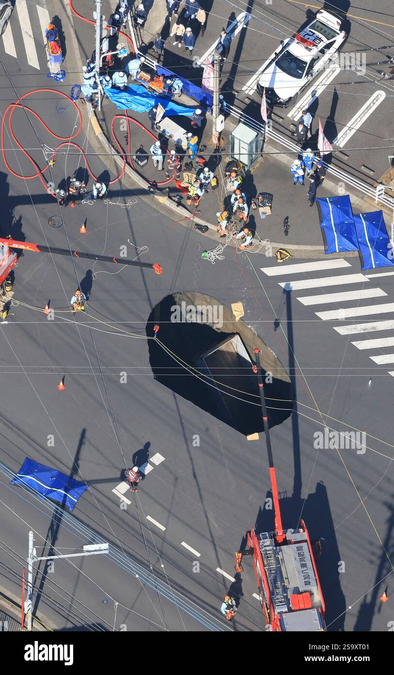 An aerial photo shows a road collapsed site and trapping a track driver ...