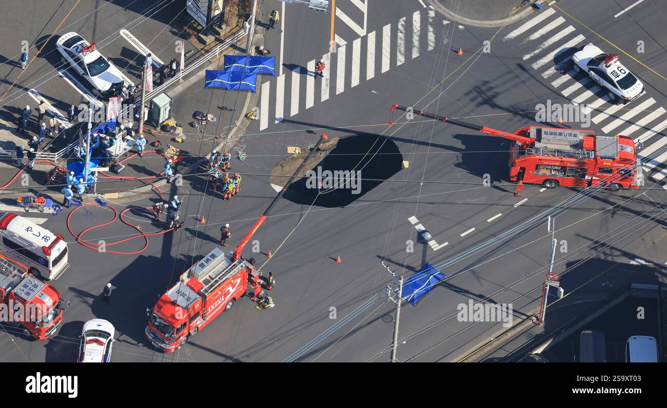 An aerial photo shows a road collapsed site and trapping a track driver ...