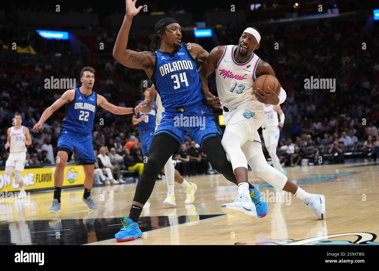 Miami Heat center Bam Adebayo (13) drives to the basket as Orlando ...