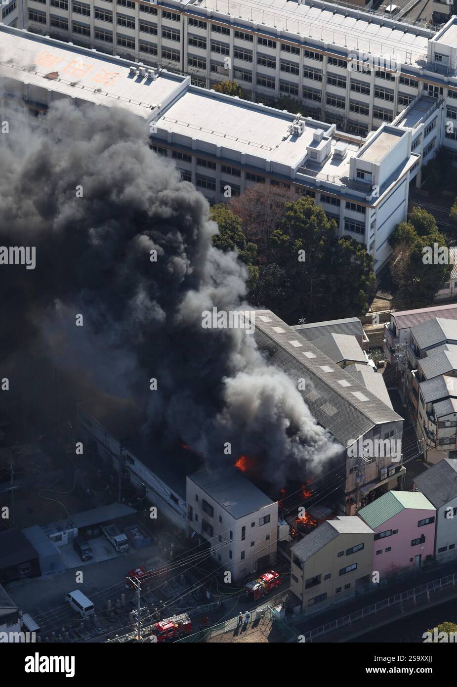 An aerial photo shows a fire scene at a warehouse area in Osaka City ...