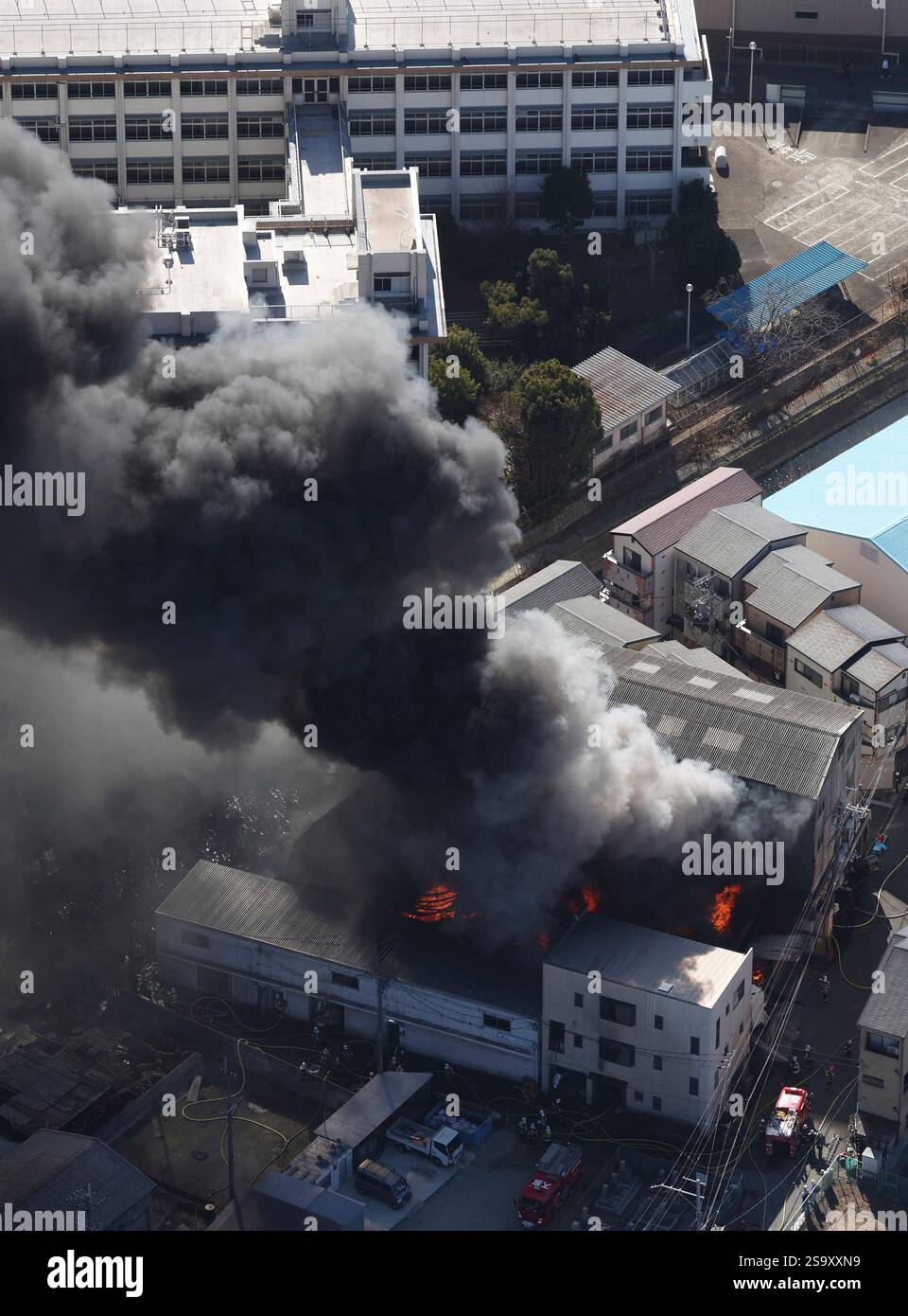 An aerial photo shows a fire scene at a warehouse area in Osaka City ...