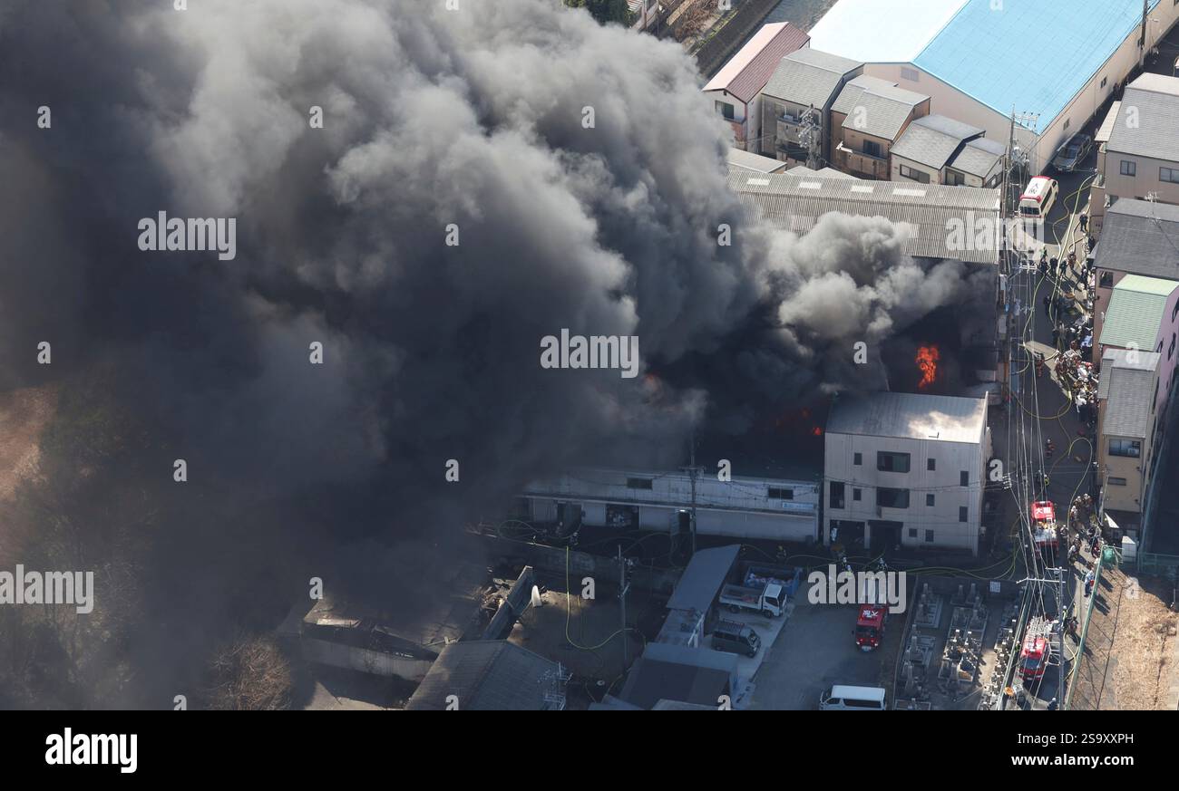 An aerial photo shows a fire scene at a warehouse area in Osaka City ...