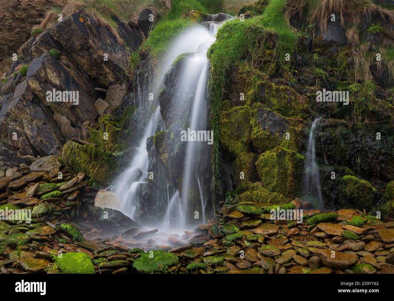 Ireland, Ferriter's Cove. Close-up of waterfall and mossy rocks Stock ...