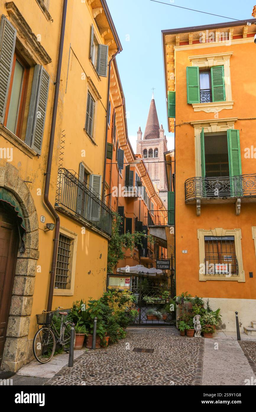 Verona, Italy. Church tower in the middle of painted Italian Venetian ...