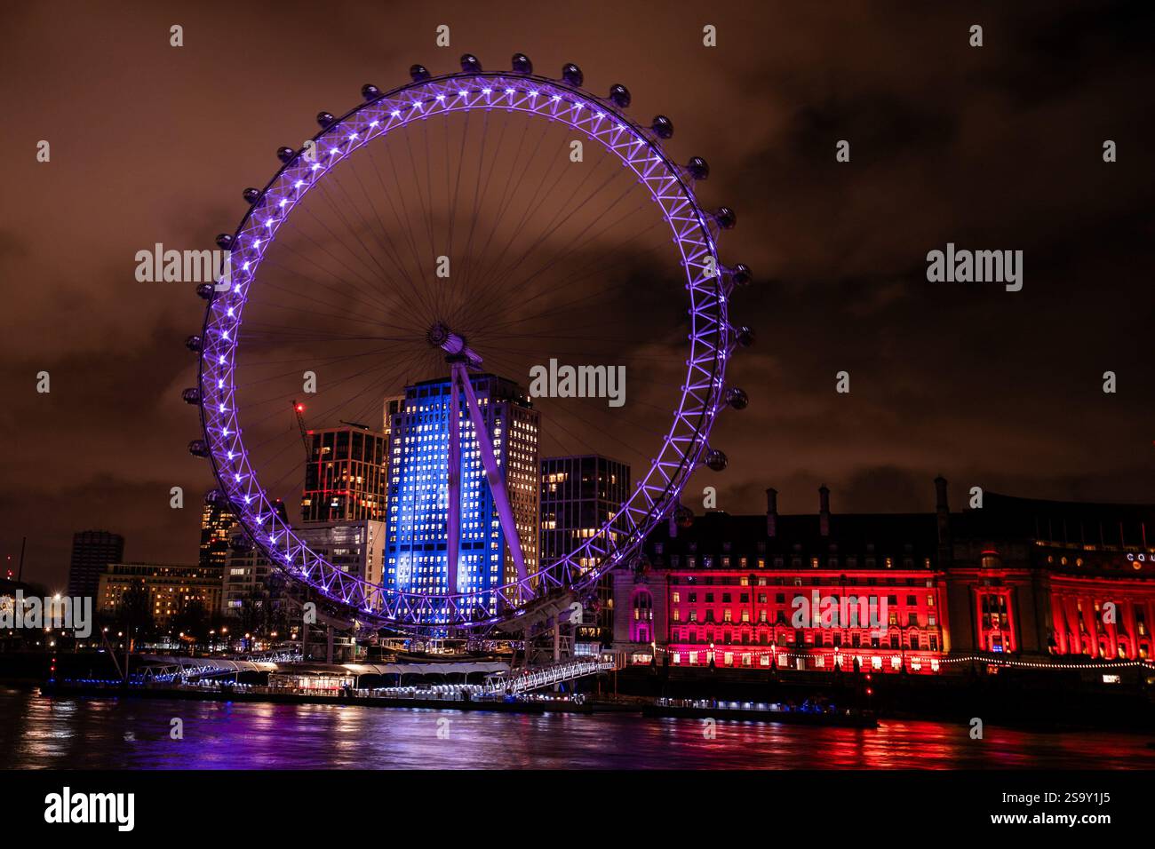 London, UK. 27th Jan, 2025. The London Eye on the River Thames, lit up ...