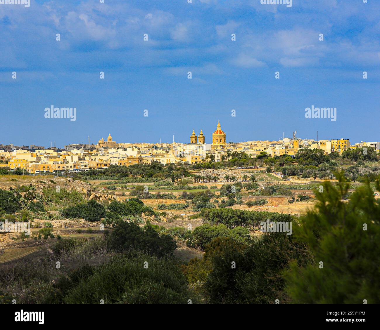 Gozo, Malta. Red cathedral domes and limestone bucolic village green ...