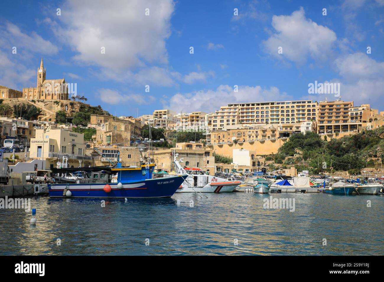 Gozo, Malta. Gozo boat marina and Lady of Lourdes cathedral Stock Photo ...